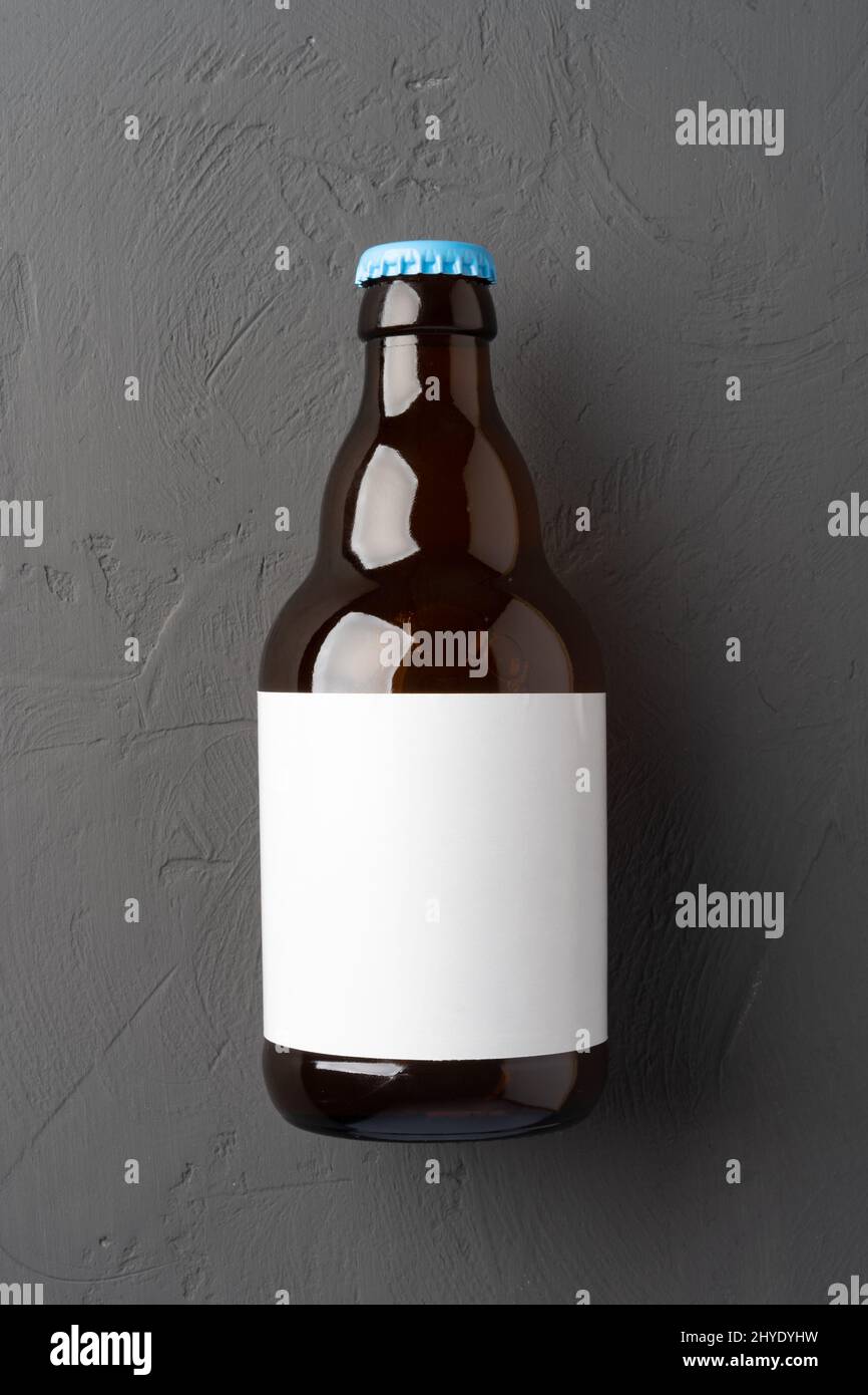 Beer bottle, on gray stone background, top view, with copy space for ...