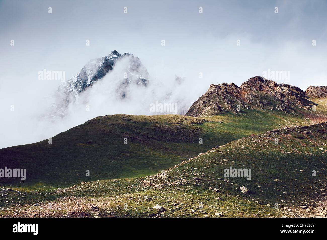 Fantastic range in mist at the foot Ushba. Dramatic foggy scene ...