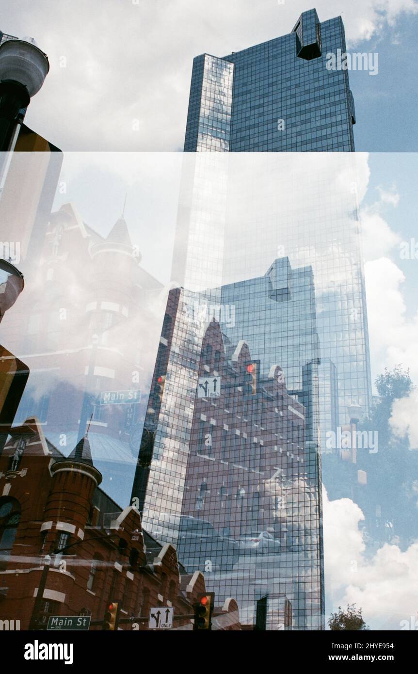Beautiful view of tall buildings in the city from a reflective window ...