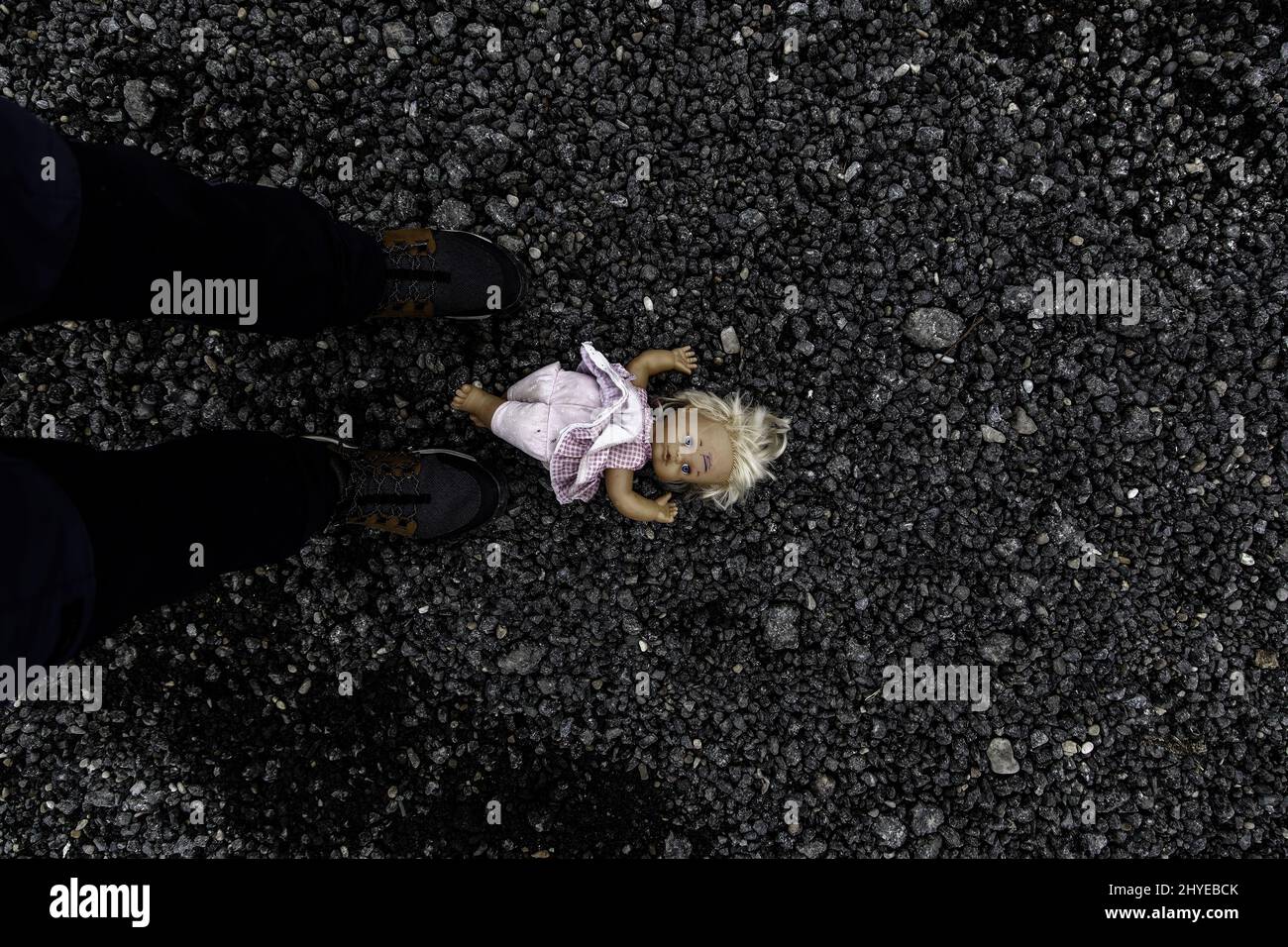 Broken doll among rubble, war childhood destroyed Stock Photo - Alamy