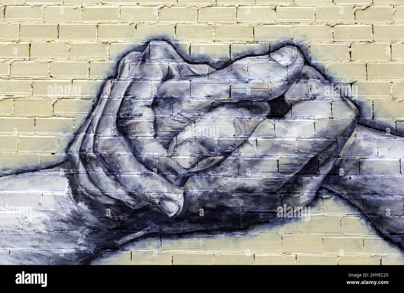 Drawing hands together symbol of peace on wall, friendship Stock Photo ...
