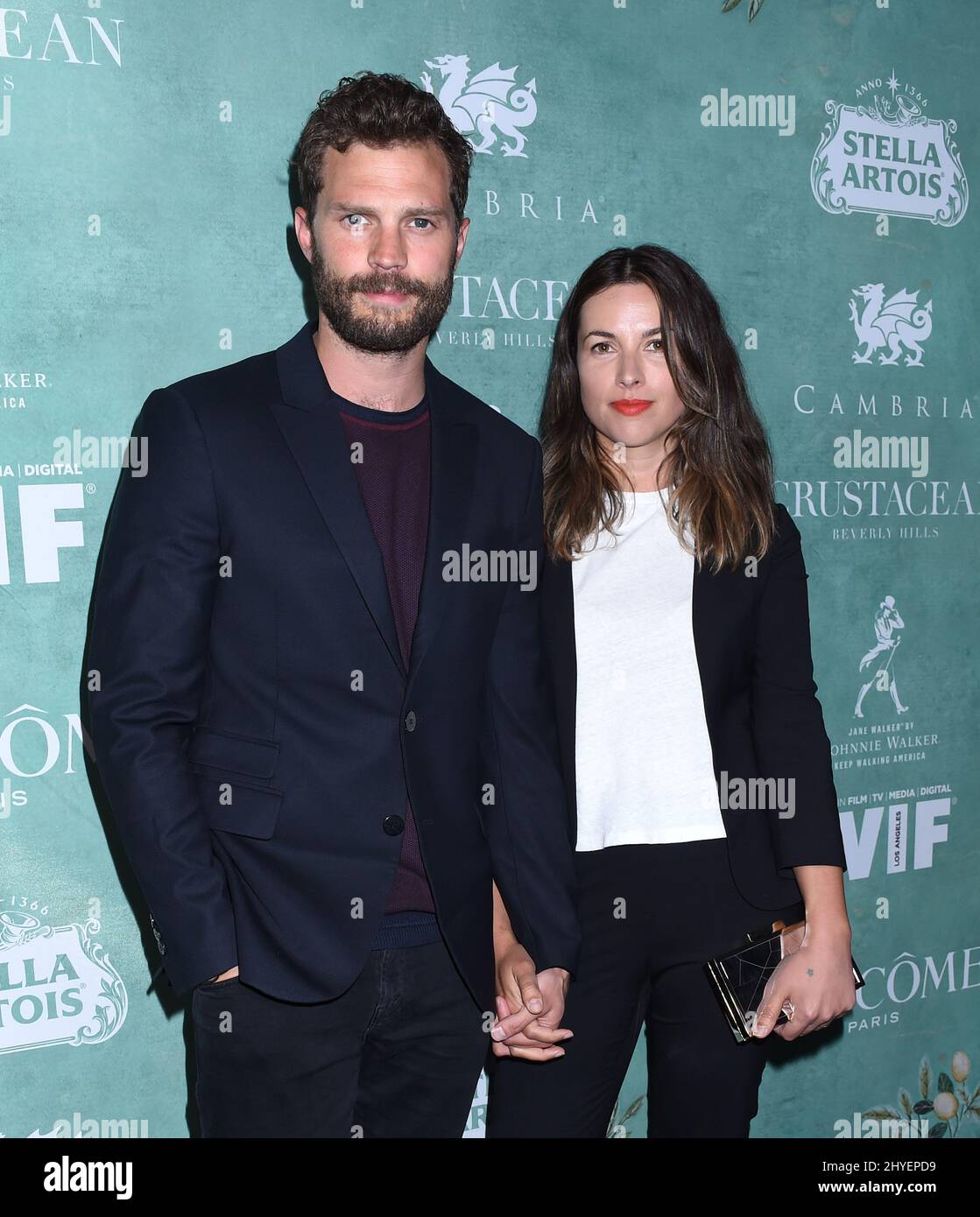 Jamie Dornan and Amelia Warner attends the 10th Woman In Film Pre-Oscar Cocktail Party - Beverly ...