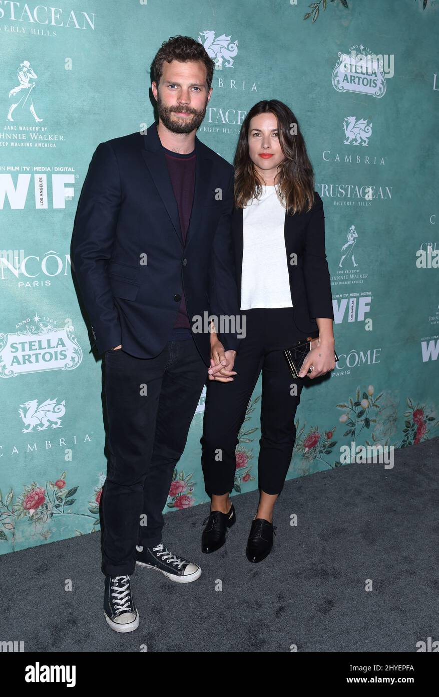 Jamie Dornan and Amelia Warner attends the 10th Woman In Film Pre-Oscar Cocktail Party - Beverly ...