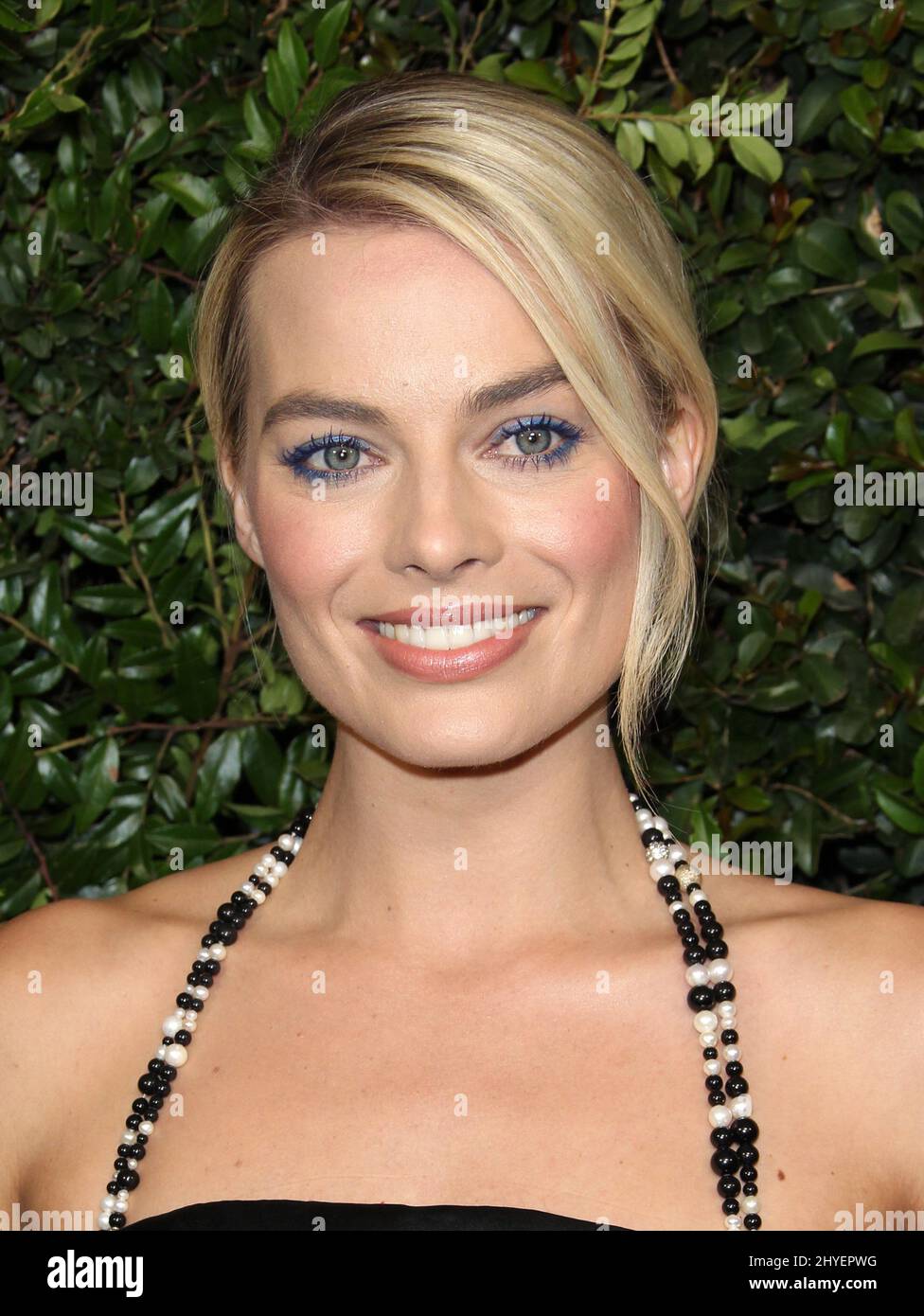 Margot Robbie attends Charles Finch And Chanel Pre-Oscar Awards Dinner ...