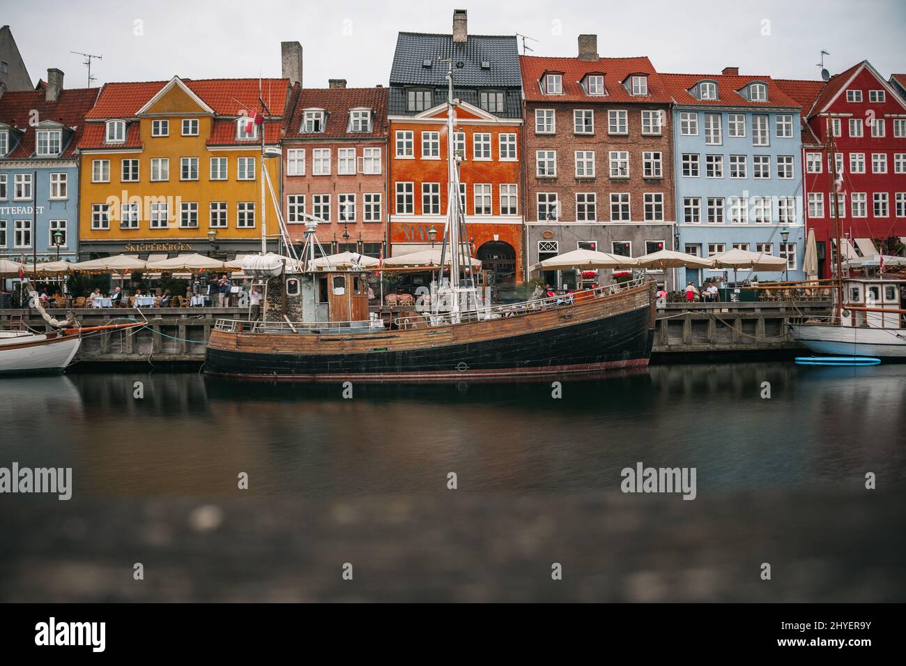 Colorful buildings and boats on canal in Copenhagen, Denmark Stock ...