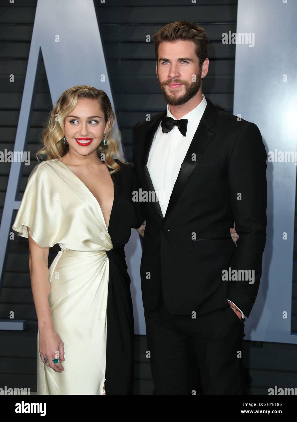Miley Cyrus and Liam Hemsworth attending the Vanity Fair Oscar Party ...