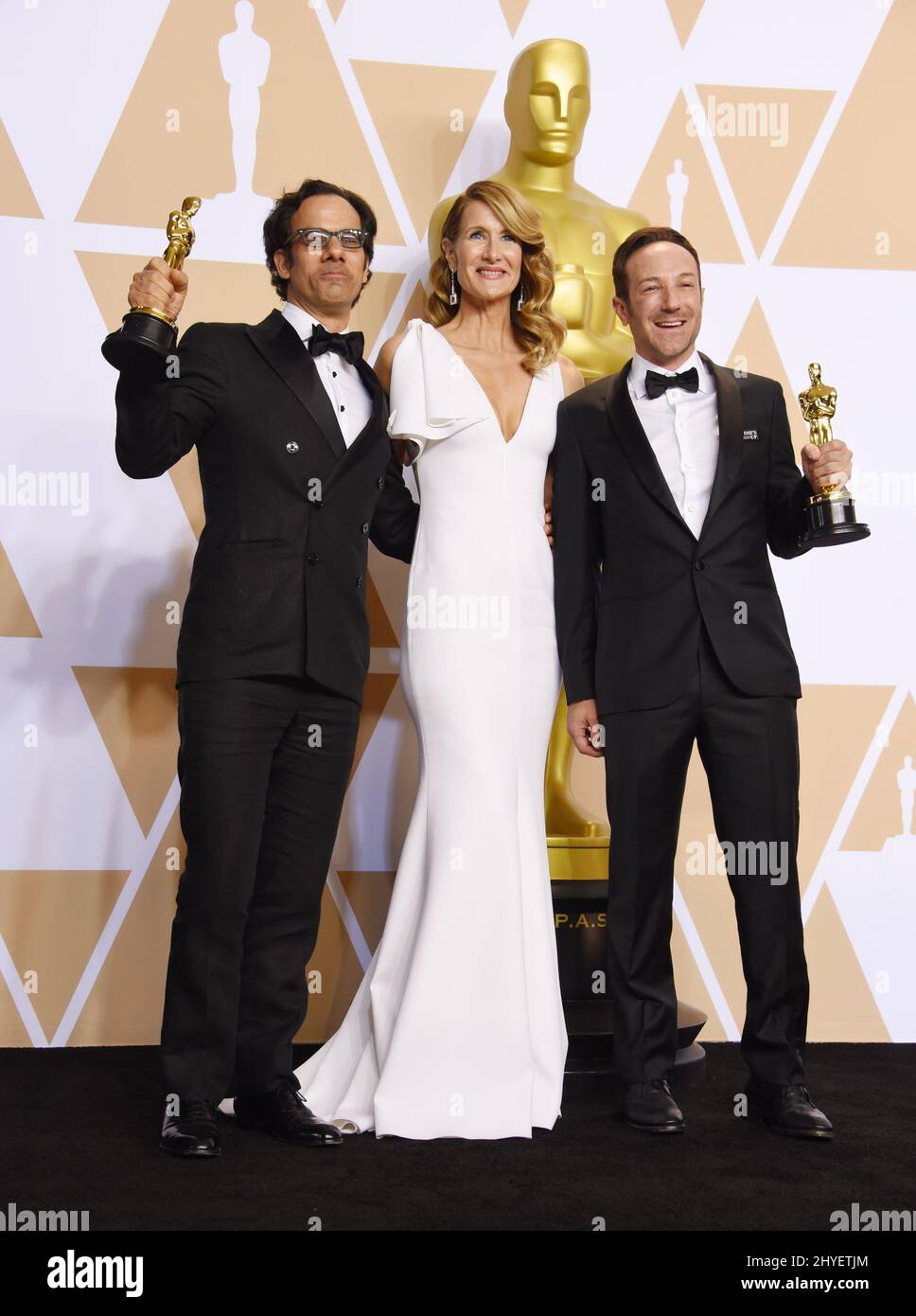 Bryan Fogel, Laura Dern and Dan Cogan in the pressroom at the 90th ...