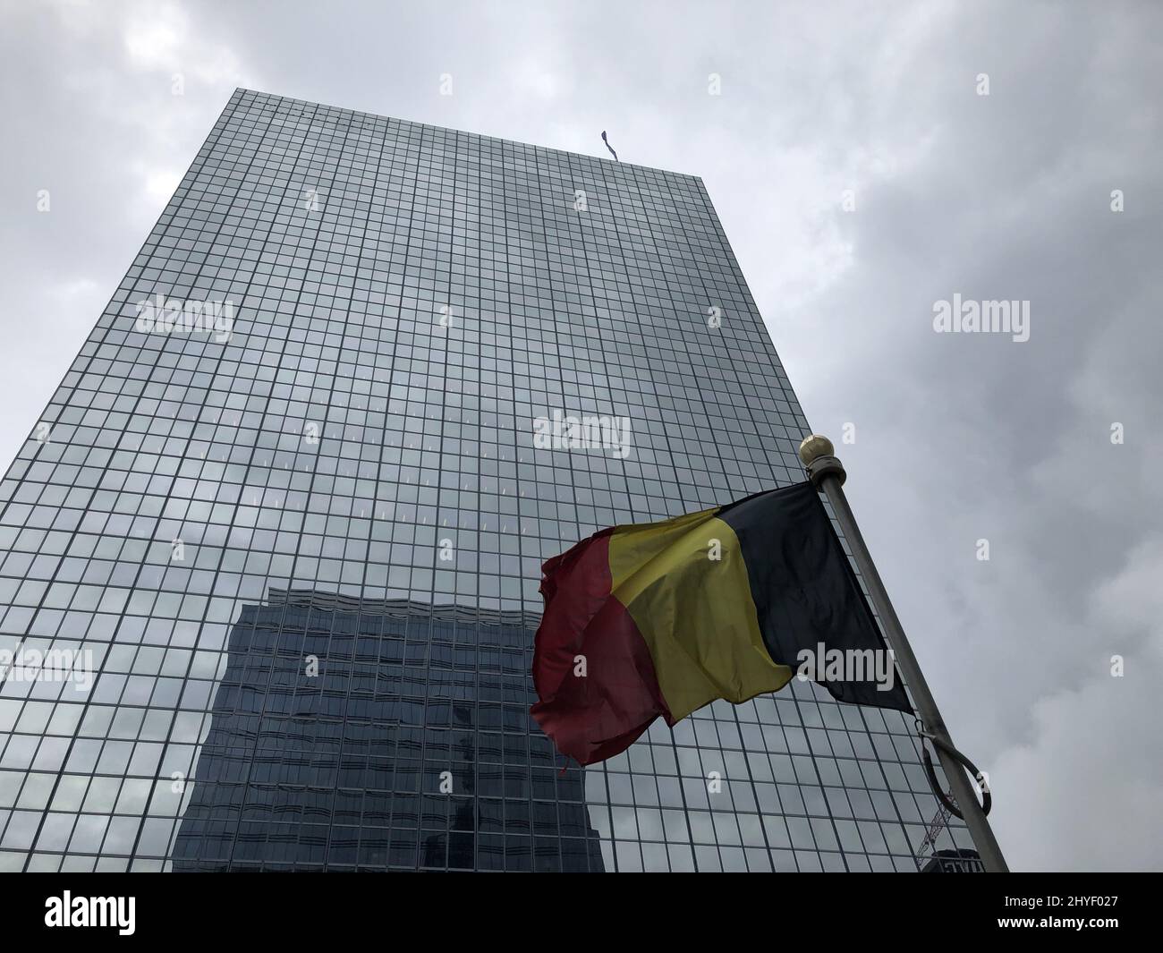 Low angle shot of the German flag with skyscraper in the back Stock ...