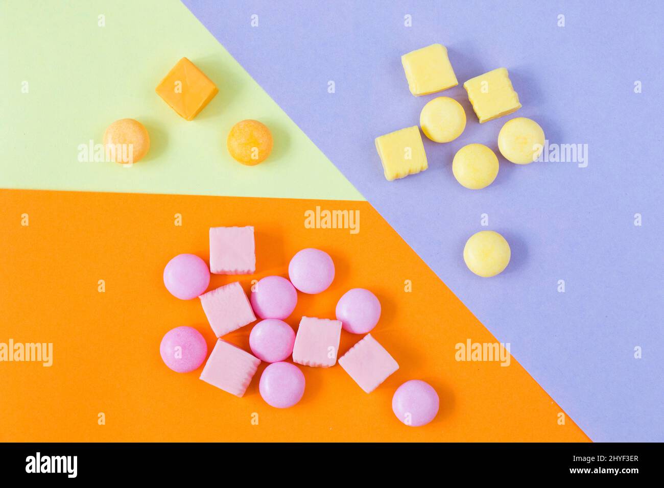 Sweet colorful confectionery, candy on the color background, high angle ...