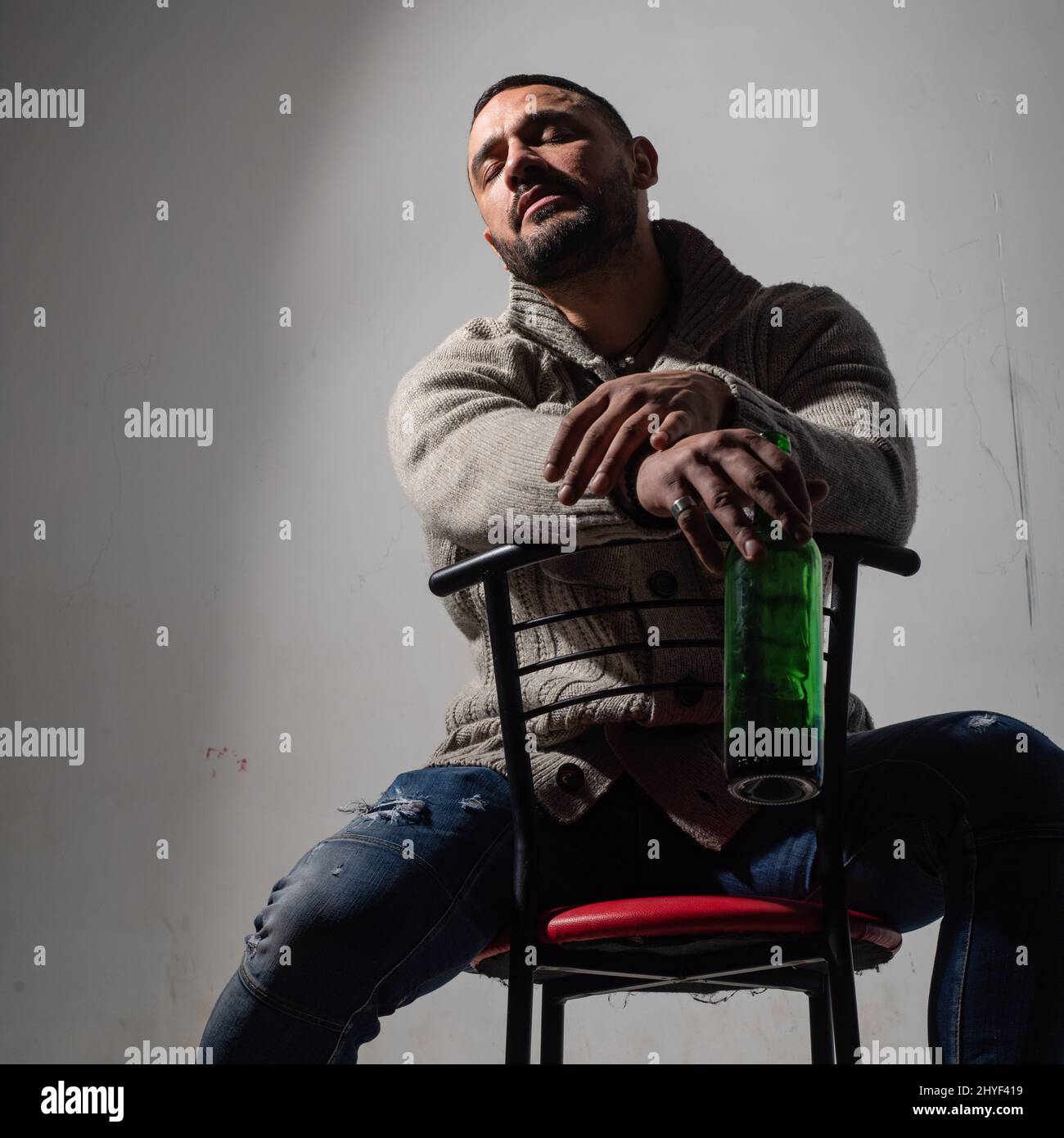 Alcoholic man with bottles wine cry. Depressed crying man. Hangover ...