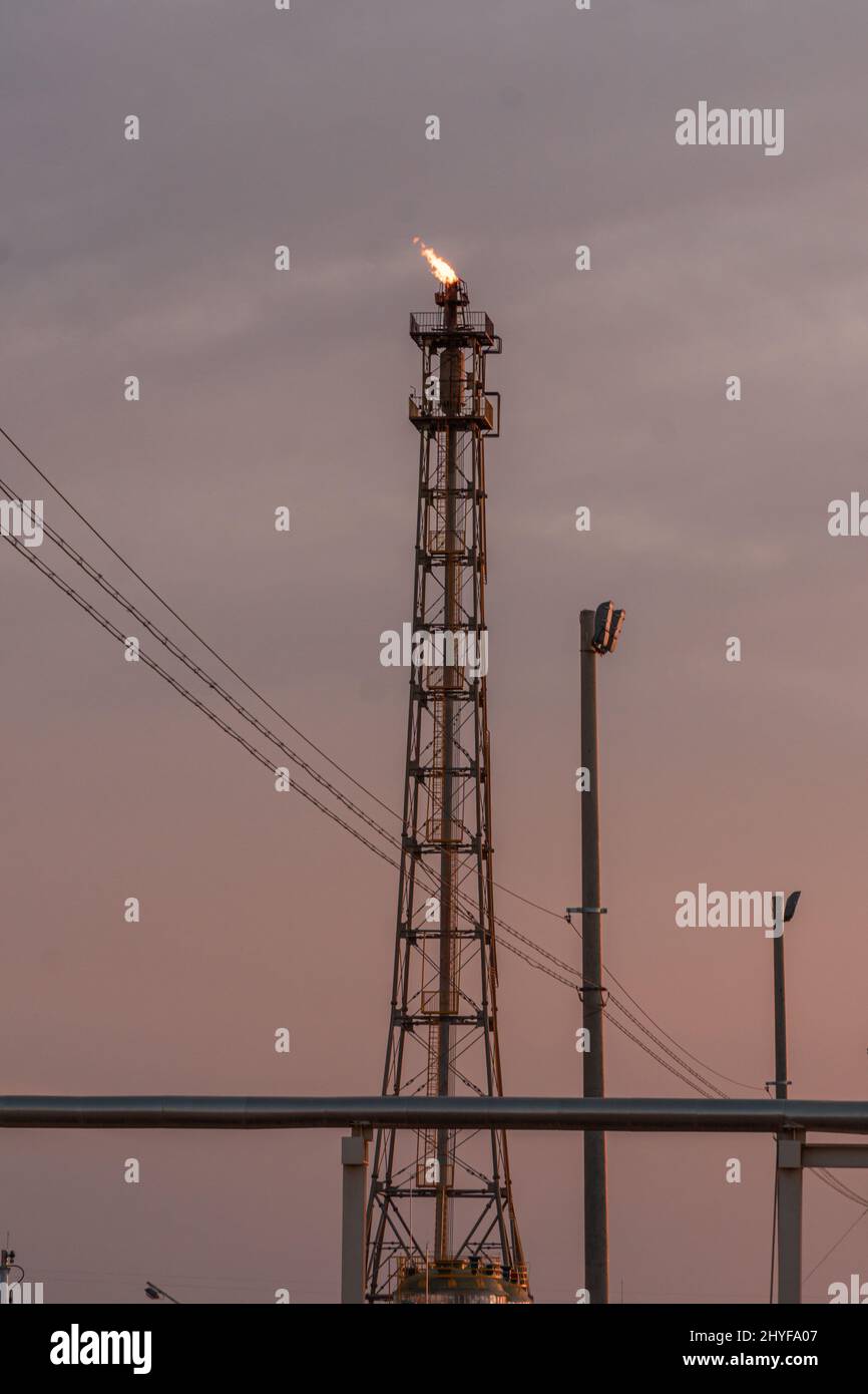 Vertical shot of a gas flare tower at a chemical plant in China Stock ...