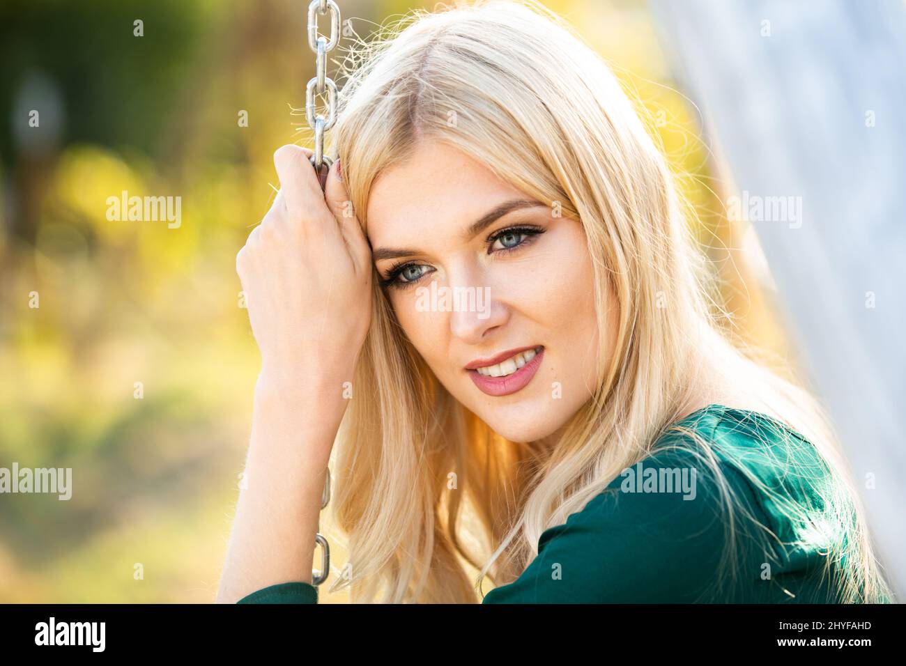 Portrait of beautiful blonde romantic young woman. Outdoor portrait of ...