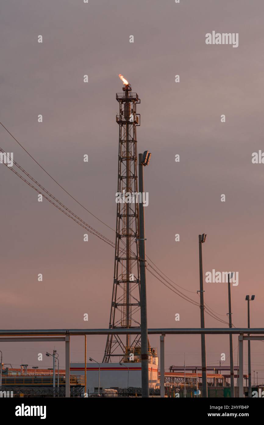 Vertical shot of a gas flare tower at a chemical plant in China Stock ...