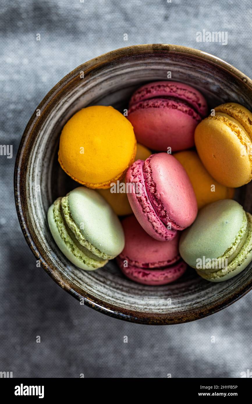 Sweet colorful macarons. Traditional french macaroons. Tasty dessert in ...