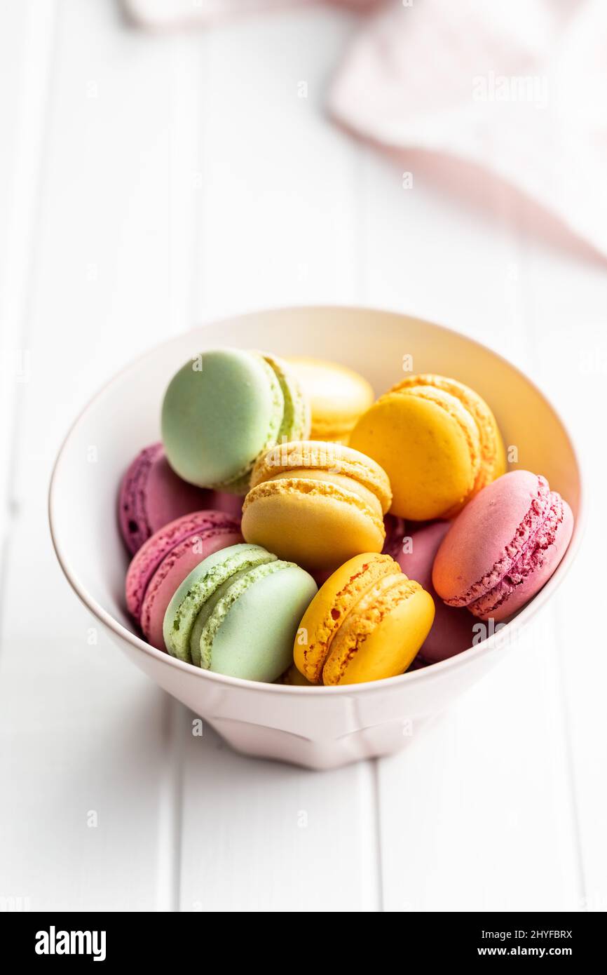 Sweet colorful macarons. Traditional french macaroons. Tasty dessert in ...