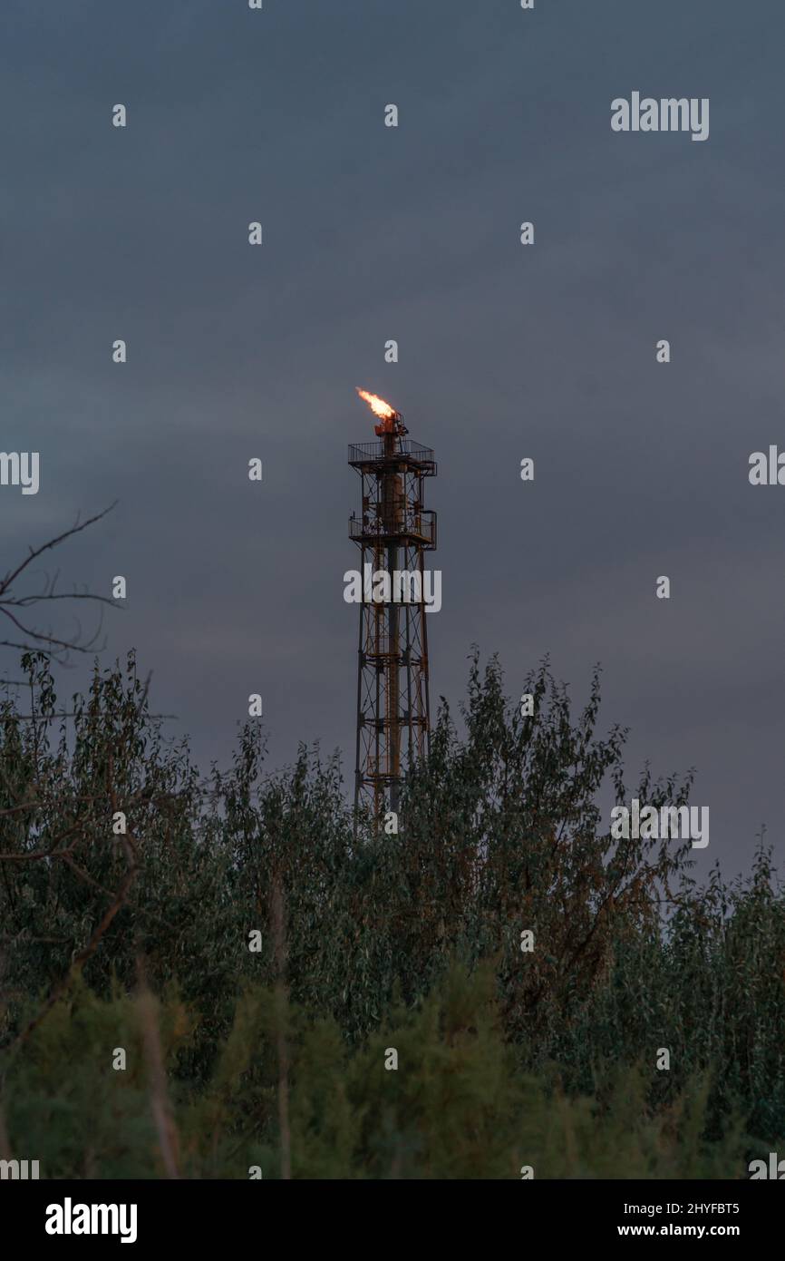 Vertical shot of a gas flare tower at a chemical plant in China Stock ...