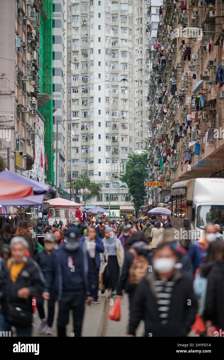 Vertical shot of crowded road with tall buildings in Hong Kong Stock ...