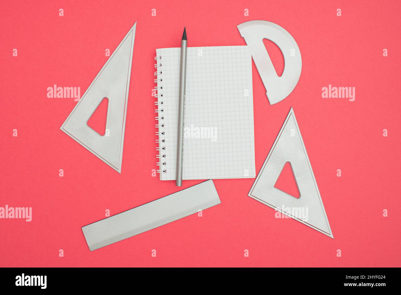 Top shot of a blank notebook with copy space surrounded by rulers and a ...