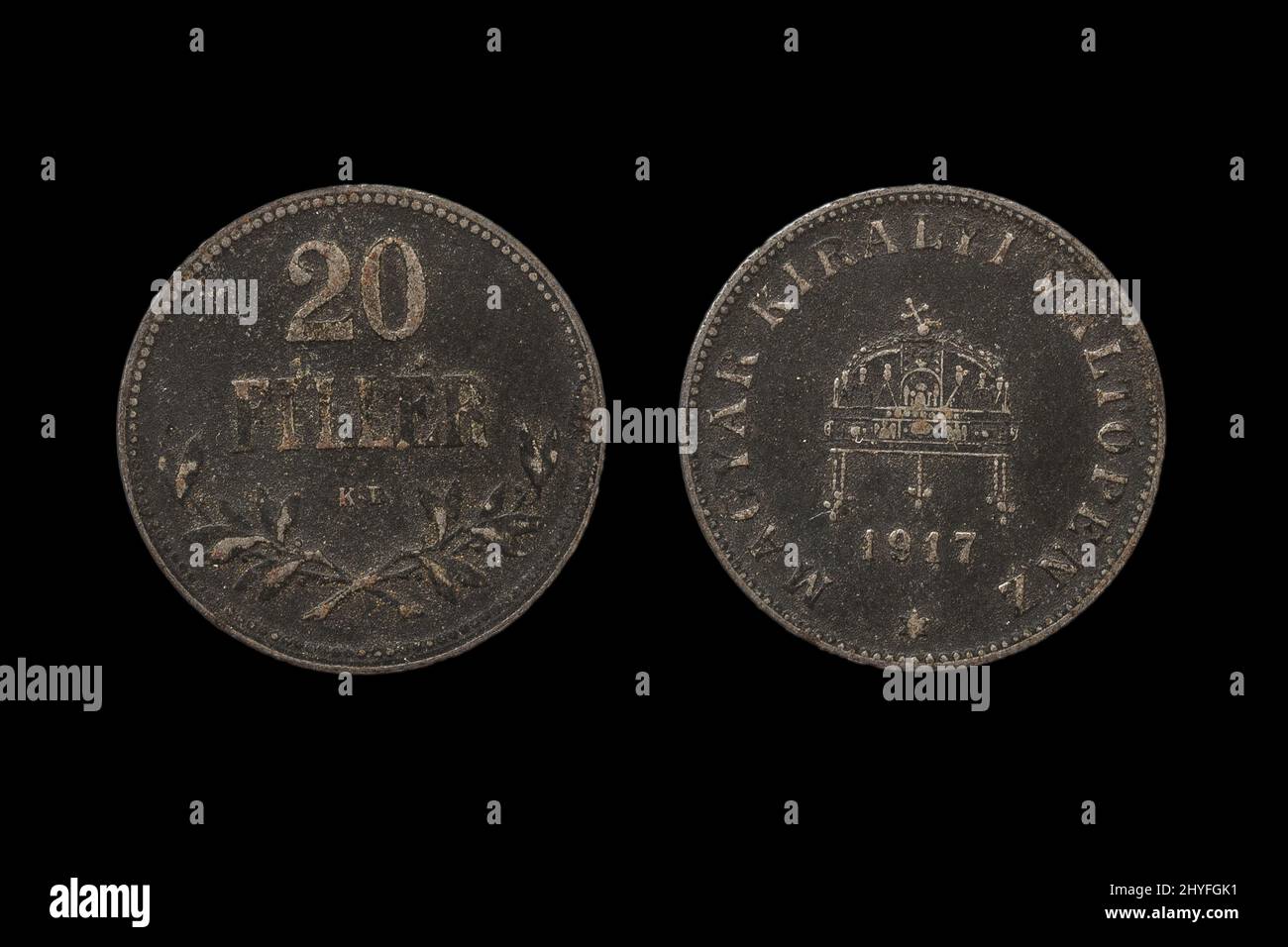 Vintage Austro-Hungarian empire 20 filler coins from 1916 on a black ...