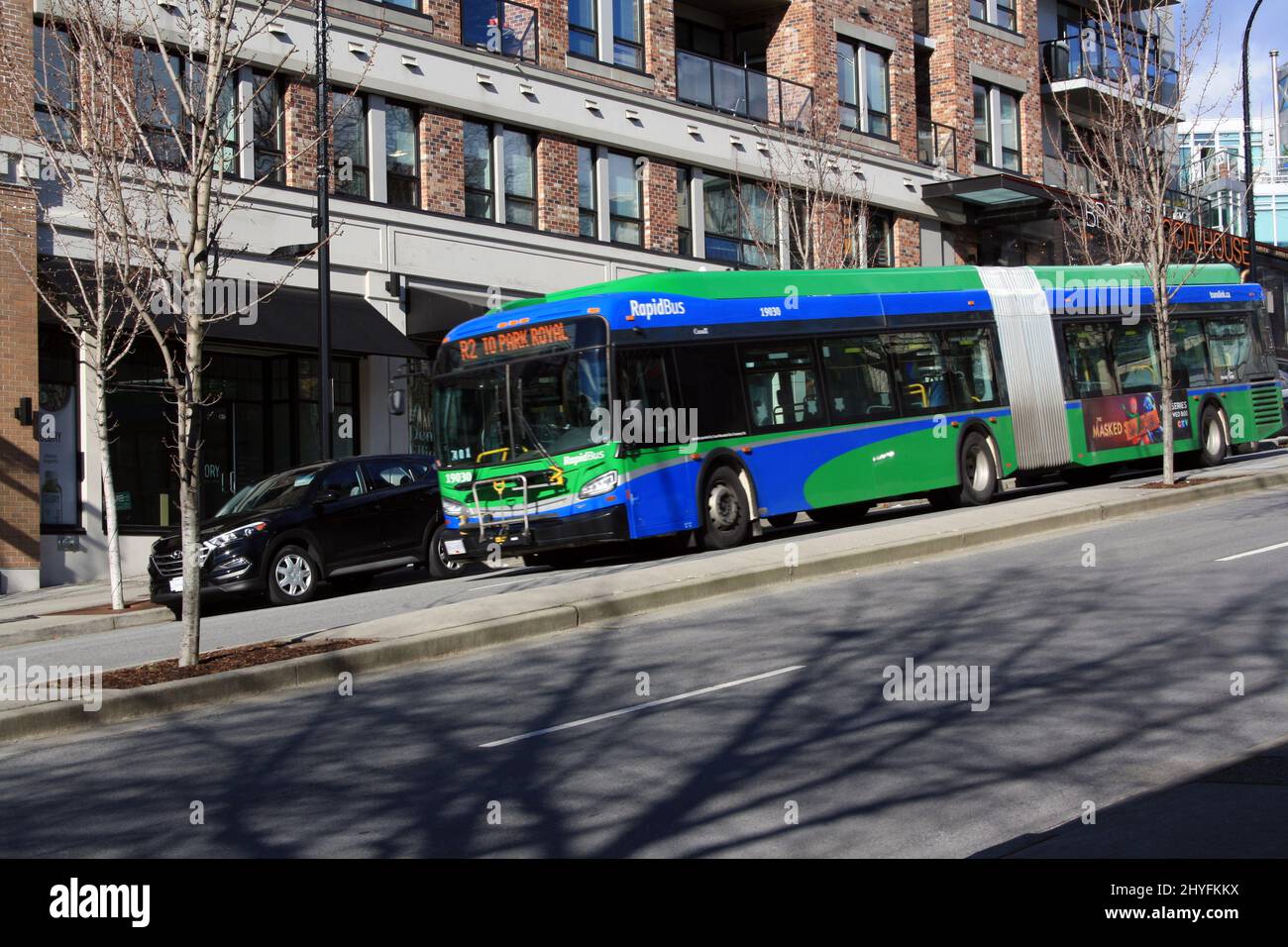 Blue green bus in the street of North Vancouver Stock Photo - Alamy