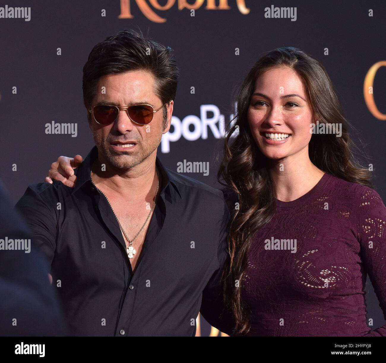 John Stamos and Caitlin McHugh attending the premiere of Christopher ...