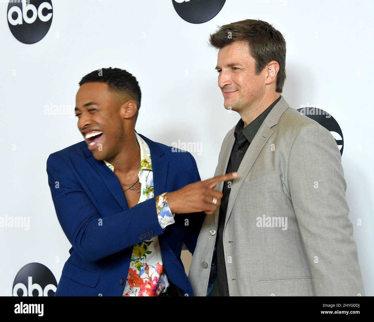 Titus Makin Jr. and Nathan Fillion at ABC's TCA Summer Press Tour white ...
