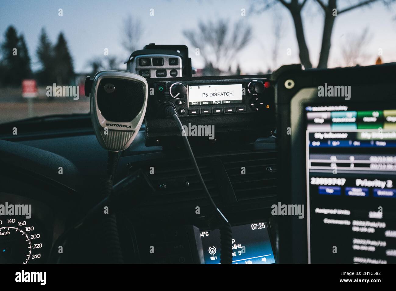 Interior of a police car showing displaying a radio system and laptop ...