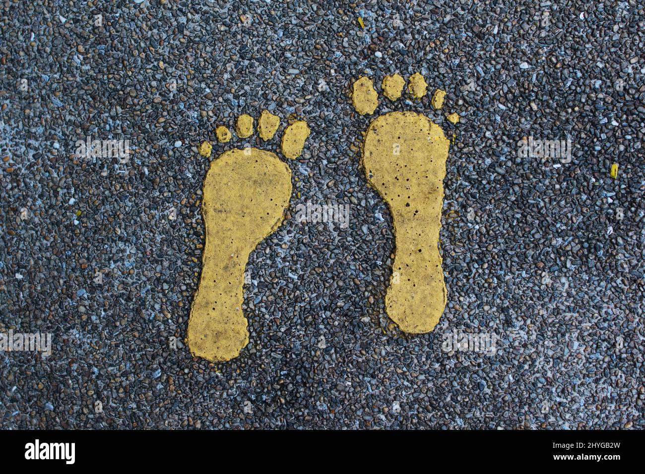 Pedestrian walkway. Footprints painted on asphalt Stock Photo - Alamy