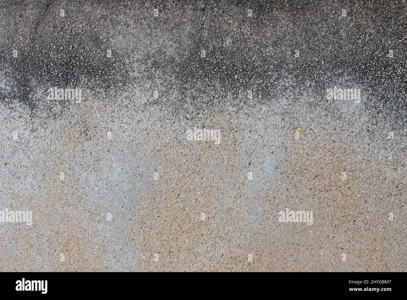 Grey cement wall partially painted with white paint Stock Photo - Alamy