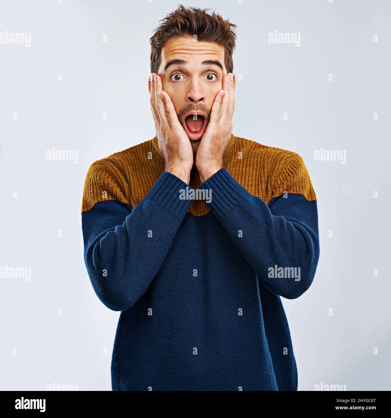 I cant believe it. Portrait of a handsome man expressing surprise ...