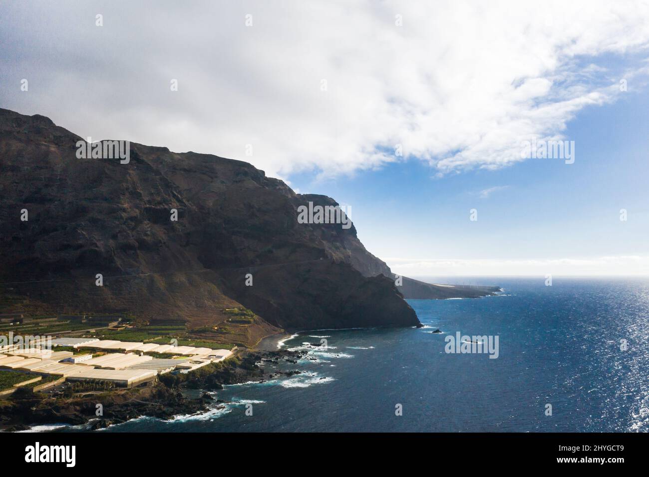 Rough rocky cliffs on the island of Tenerife.Black beach on the Canary ...