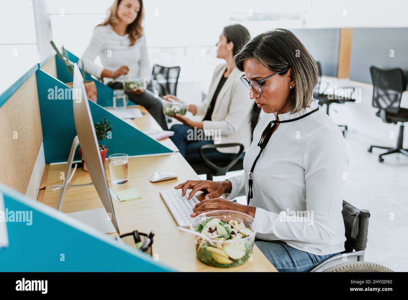 transgender latin woman on wheelchair on video call working with ...