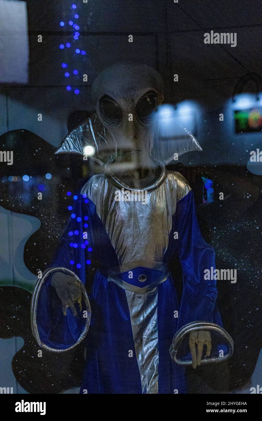 Display of an Alien behind a glass Stock Photo - Alamy