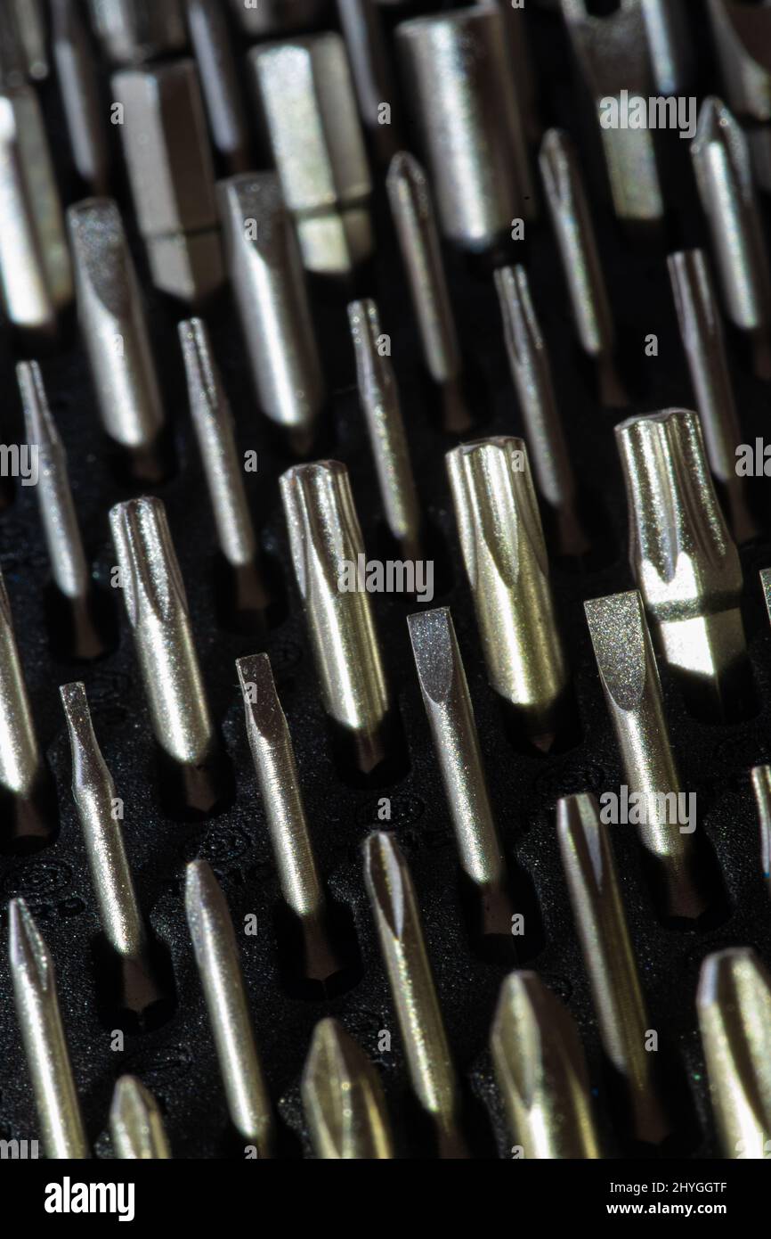 Vertical closeup shot of the screw drive heads bits in the tool box ...