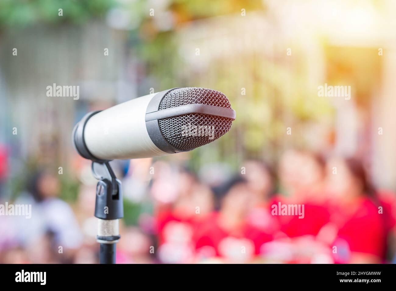 Close up of microphone in public place with blur background Stock Photo ...