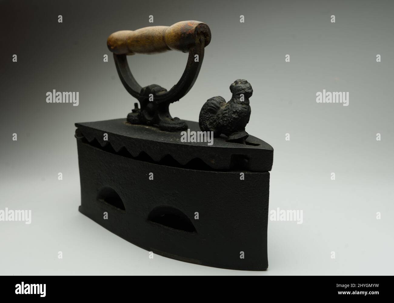 Closeup of an antique iron with a white background Stock Photo - Alamy
