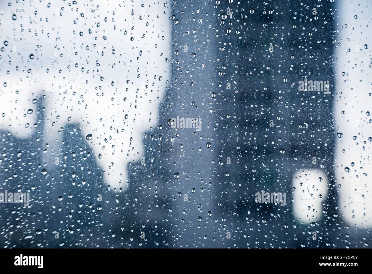 Abstract image of Rain drops on the dirty glass windows with modern ...