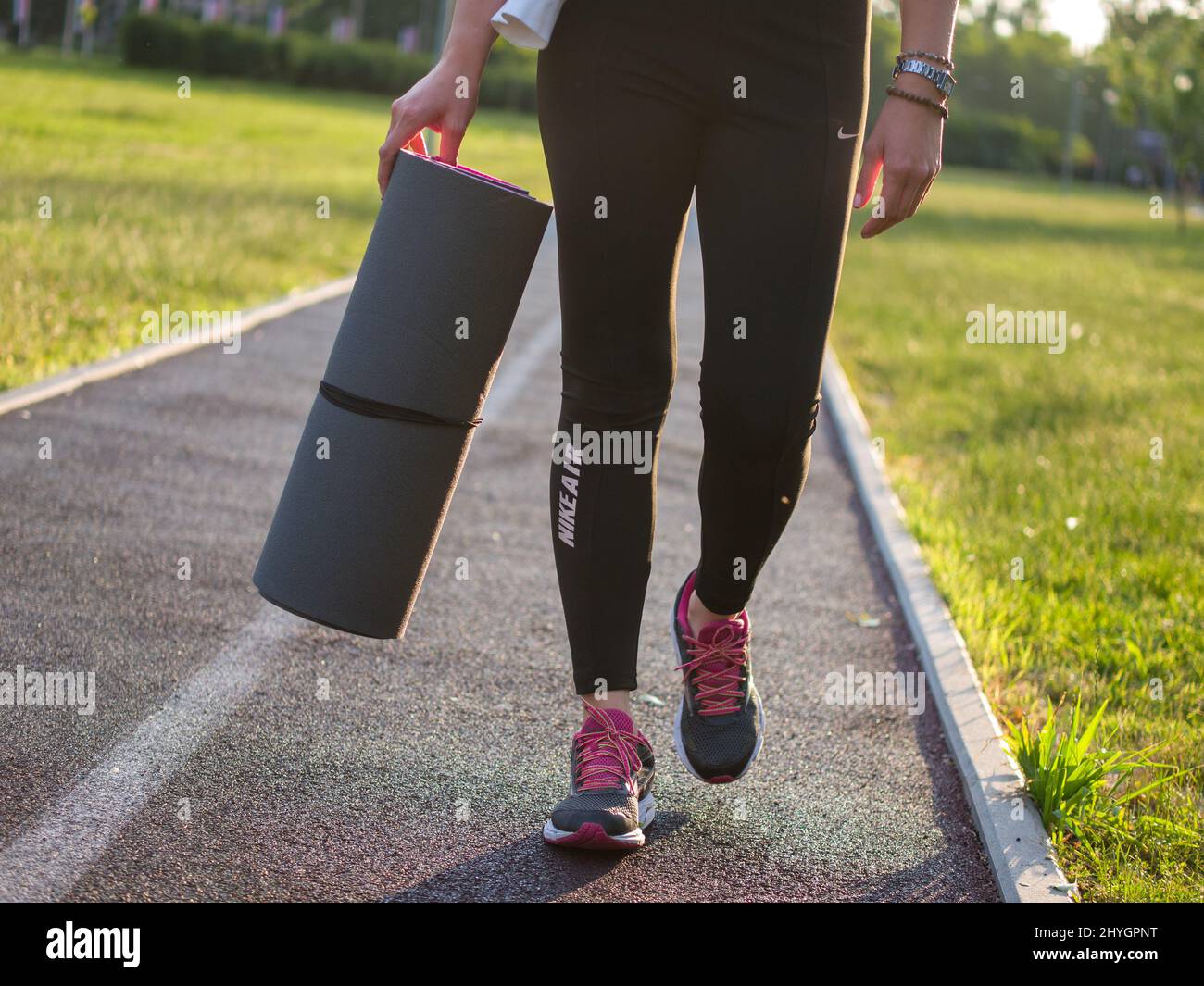 Beautiful girl training in the park at sunset bathed in the sun in ... Beautiful girl training in the park at sunset bathed in the sun in ...