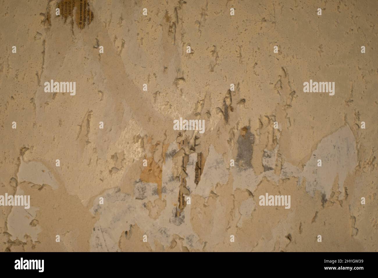 Texture of stripped wallpaper from wall. Paper is torn. Repair details ...