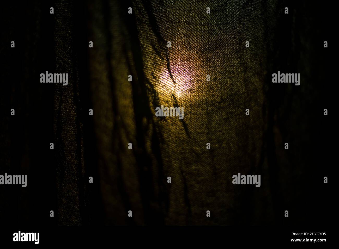 Light through fabric. Sun shines through curtains. Texture of dark ...