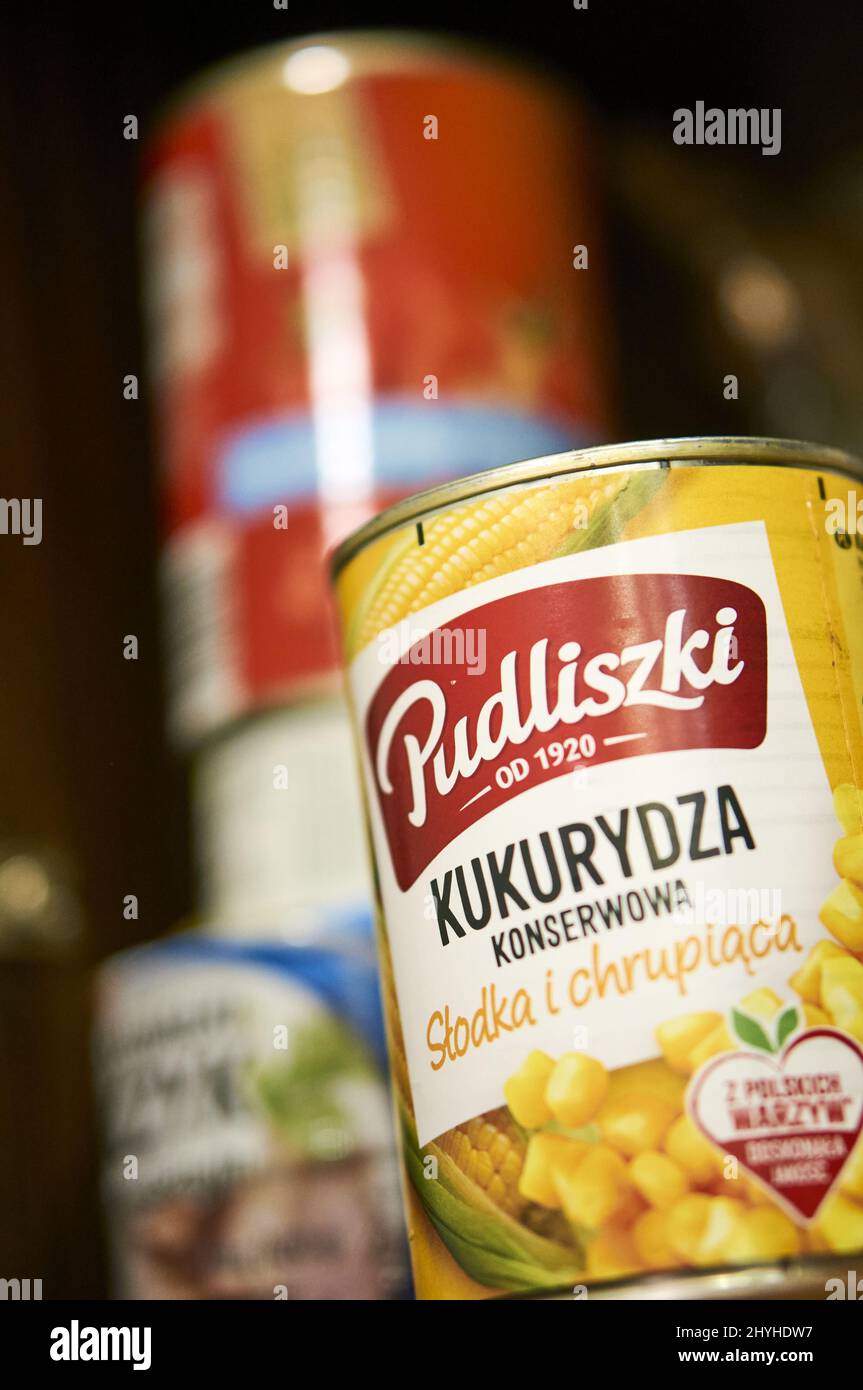Vertical closeup of a Polish Pudliszki brand sweet corn in a can on a ...