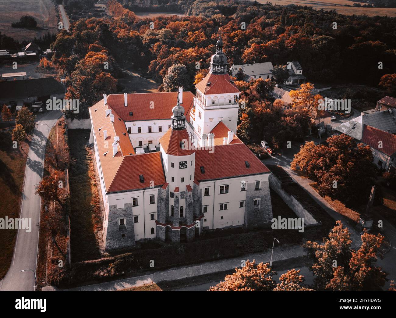 Aerial view of a castle surrounded by forest and a road in autumn Stock ...