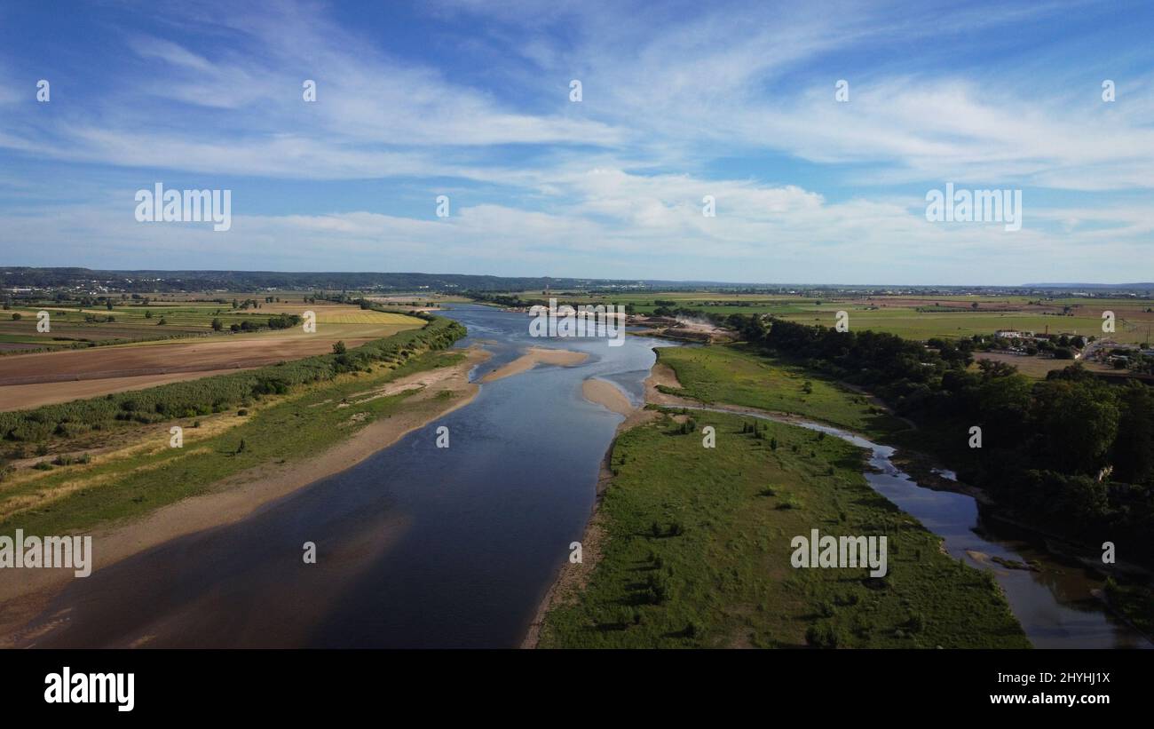 Aerial view of flowing Tejo river in Santarem, Portugal on a sunny day ...