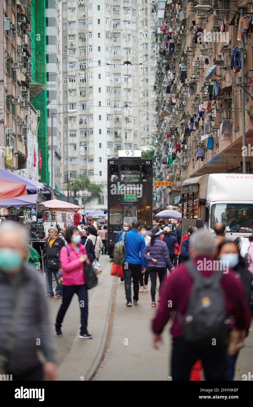 Vertical shot of the busy traffic and a crowded road with tall ...
