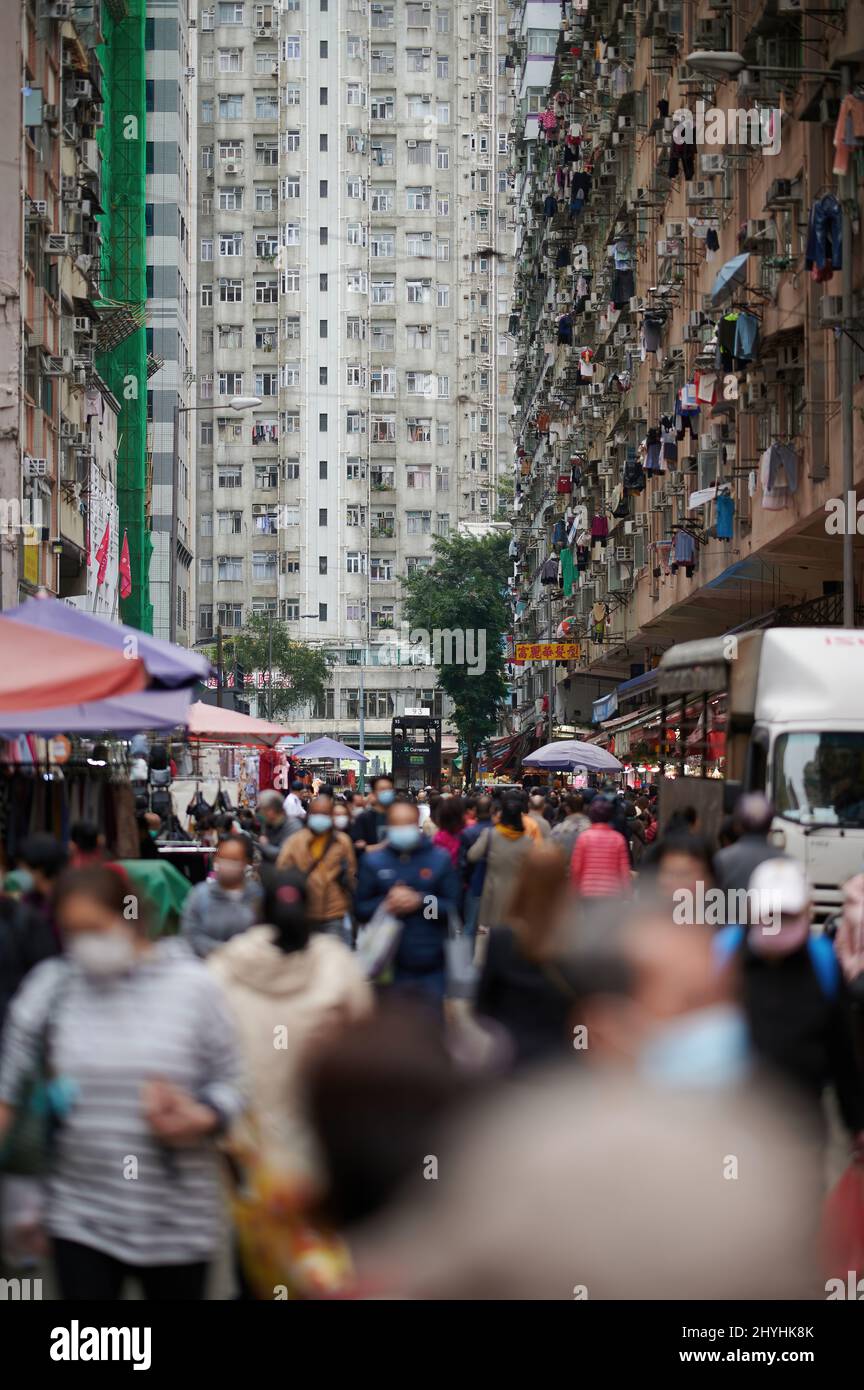 Vertical shot of a crowded road with tall buildings in Hong Kong Stock ...