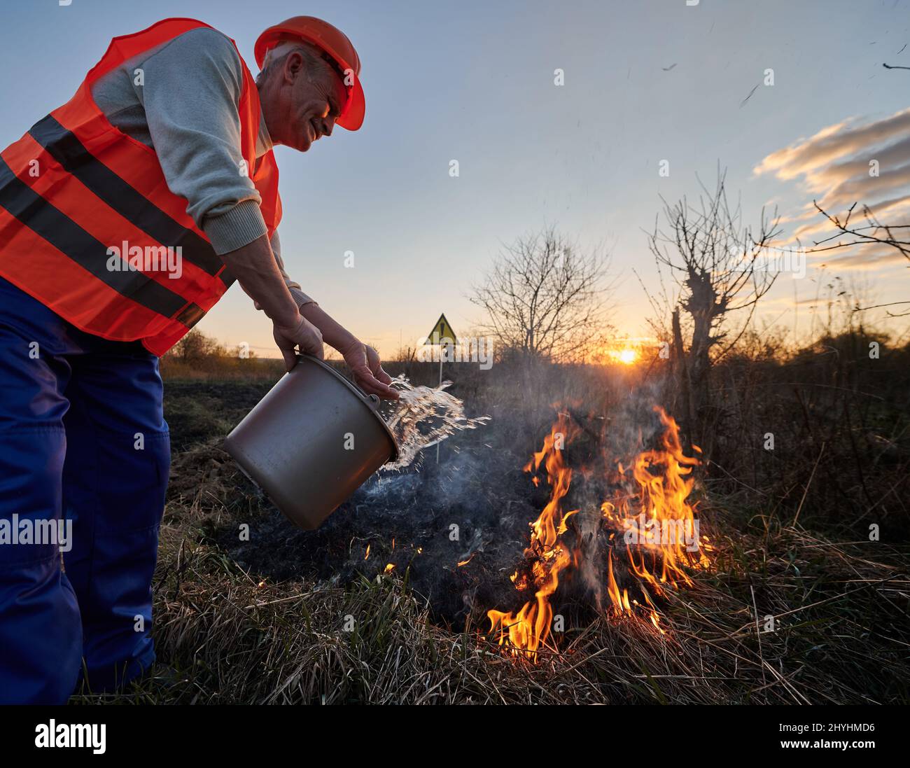 Pouring Water On A Campfire