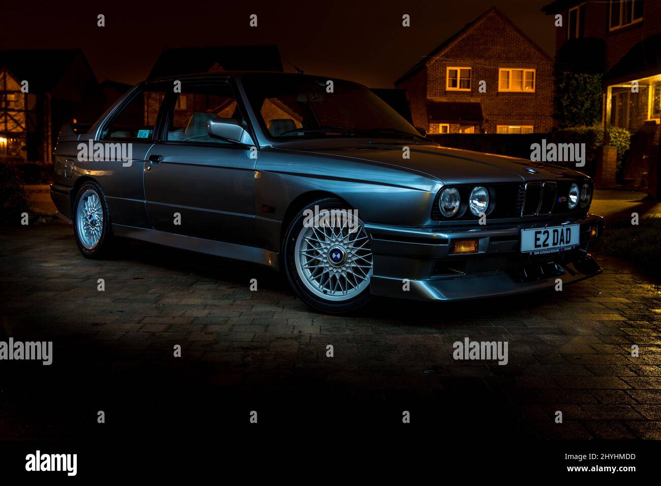 Grey BMW E30 M3 in the street at night Stock Photo - Alamy