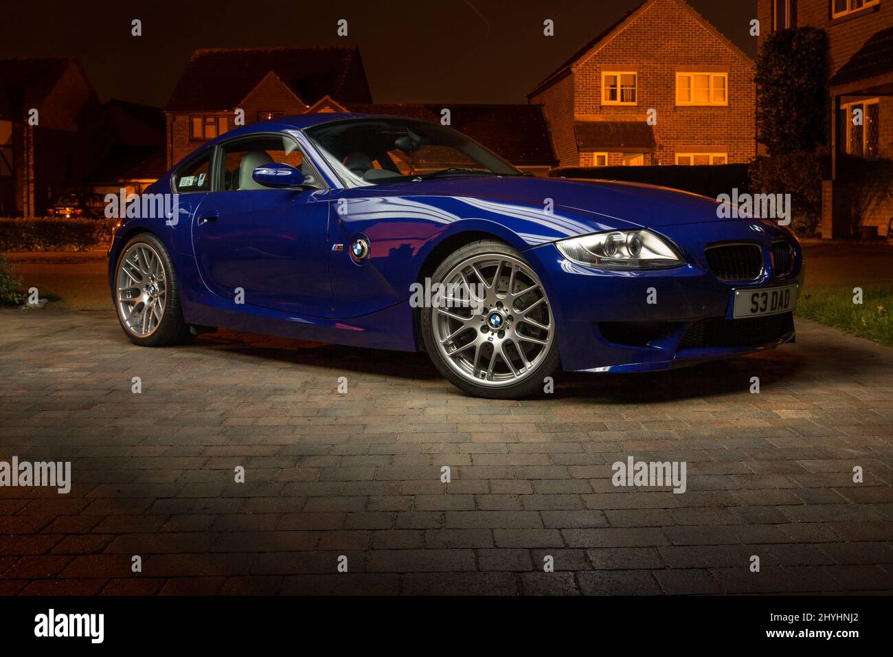 Blue BMW Z4 M Coupe in the street at night Stock Photo - Alamy