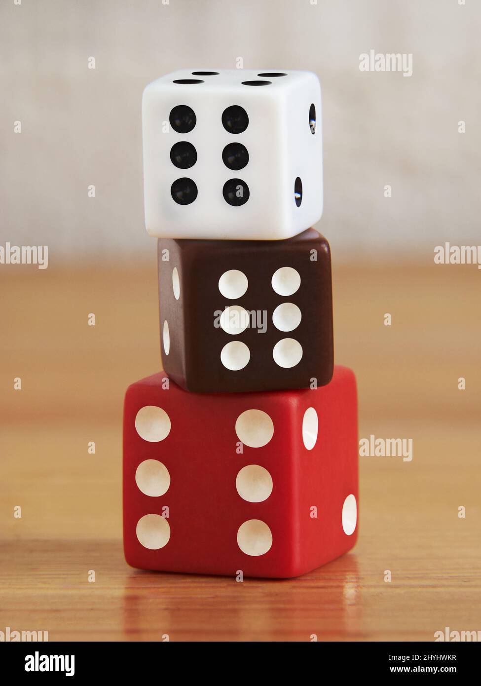 Three dice on a table hi-res stock photography and images - Alamy