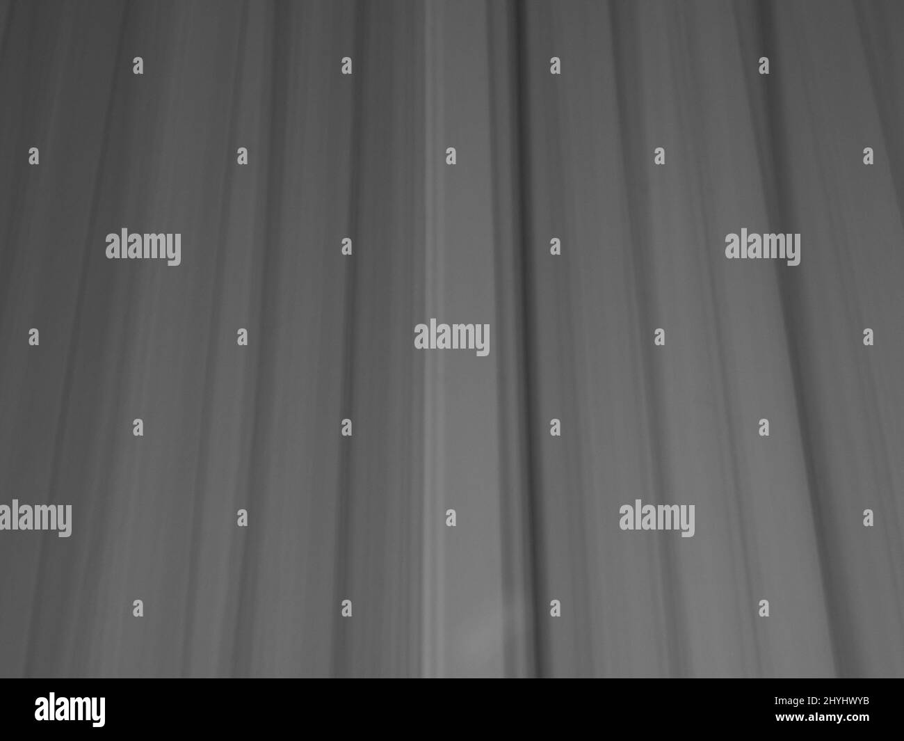 Abstract white lines background. Blurry moving silver lines converging ...